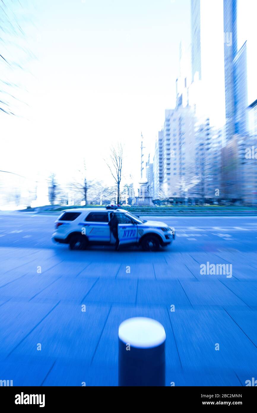 NYC police officers getting into car at an empty Columbus Circle ...