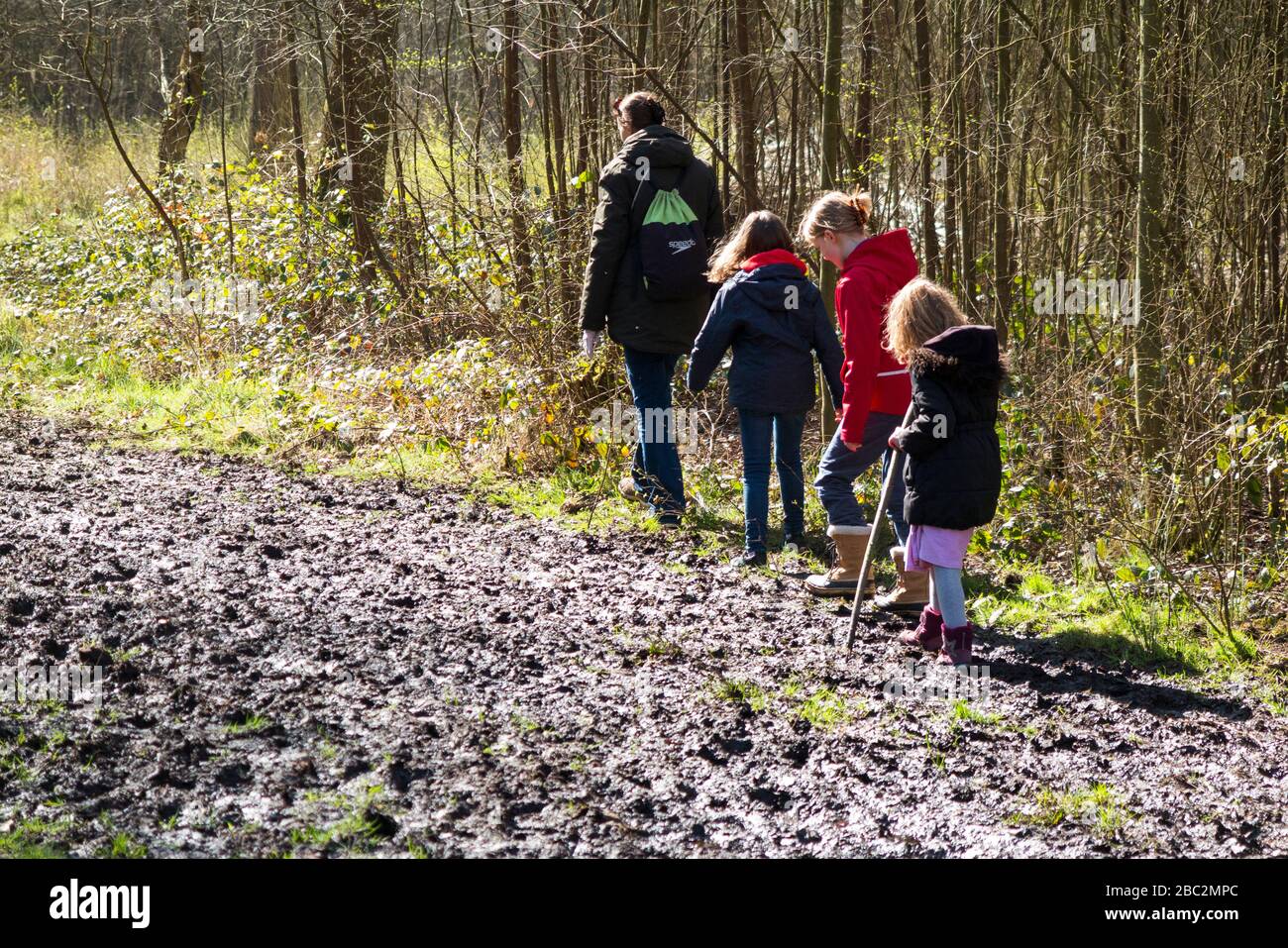 Child walking through mud hi-res stock photography and images - Alamy