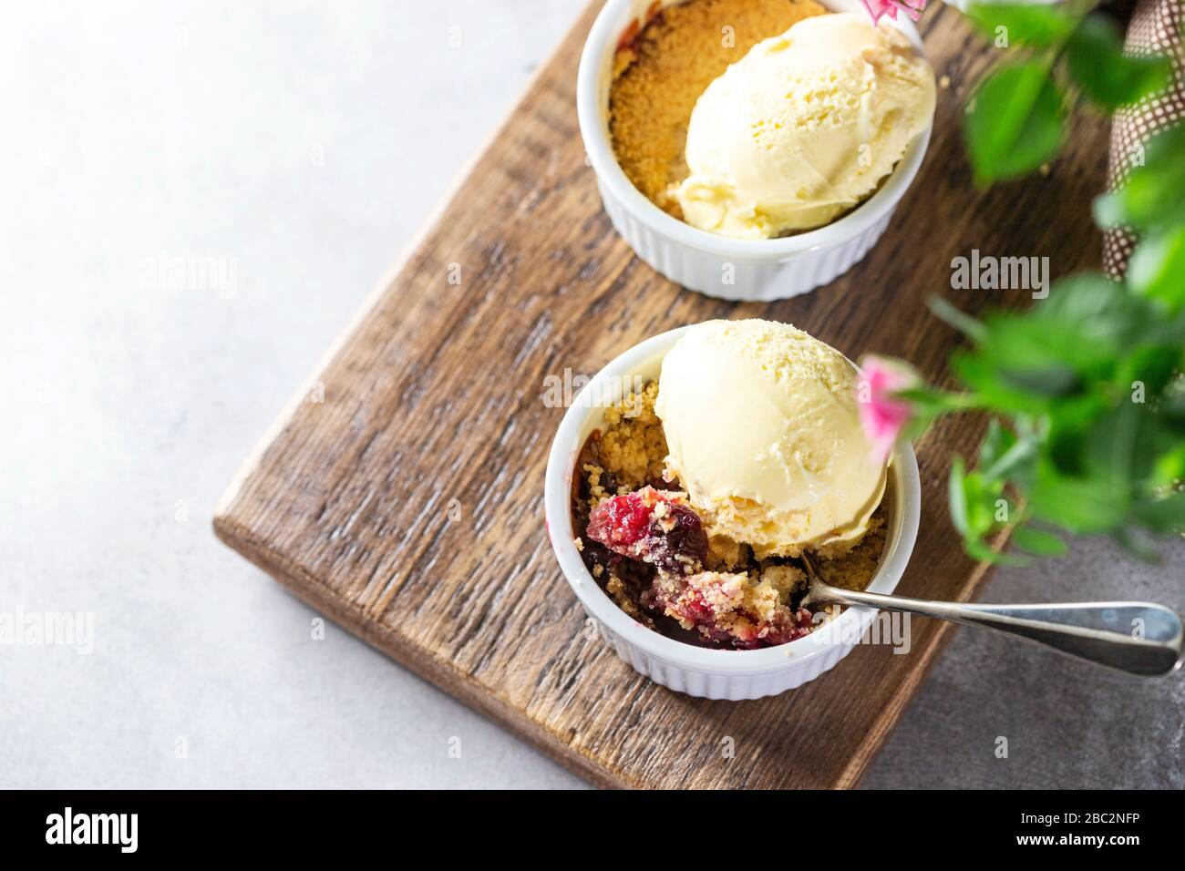 Crumble with cherry with vanilla ice cream. Selective focus, copy space ...