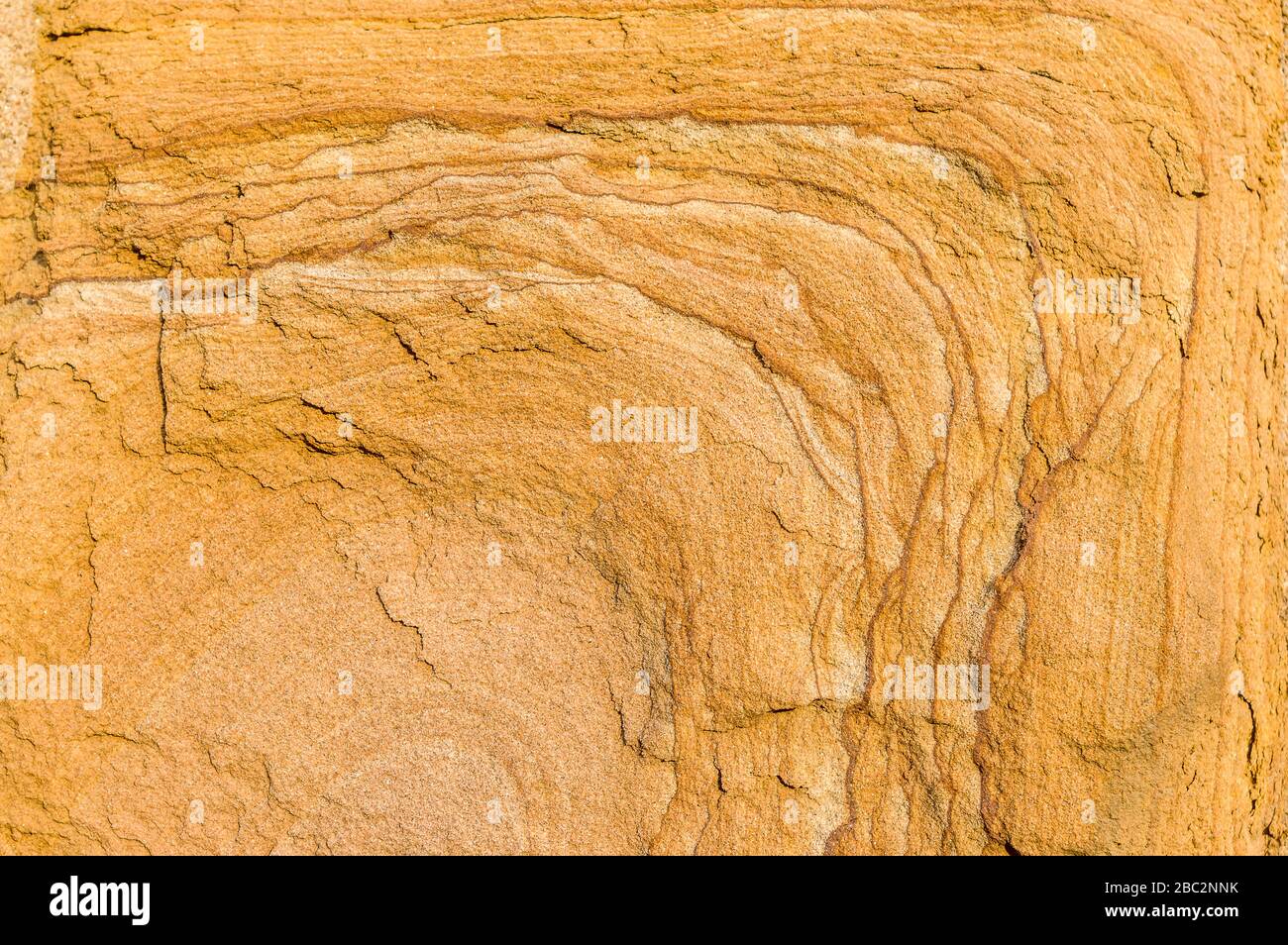 Sandstone wall, sandstone with artistic patterns hatching relief-like ...