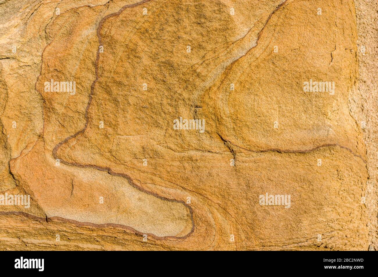 Sandstone wall, sandstone with artistic patterns hatching relief-like ...