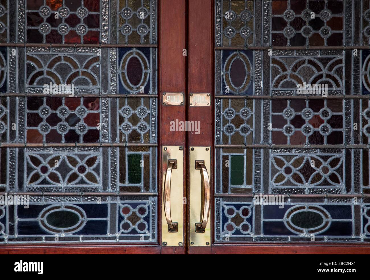 Close up on stained glass church doors of old Catholic church in ...