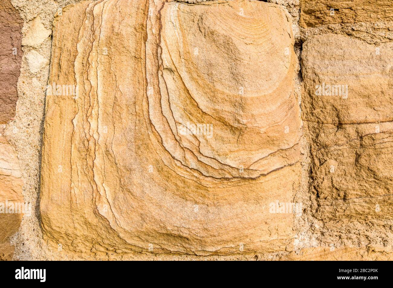 Sandstone wall, sandstone with artistic patterns hatching relief-like ...