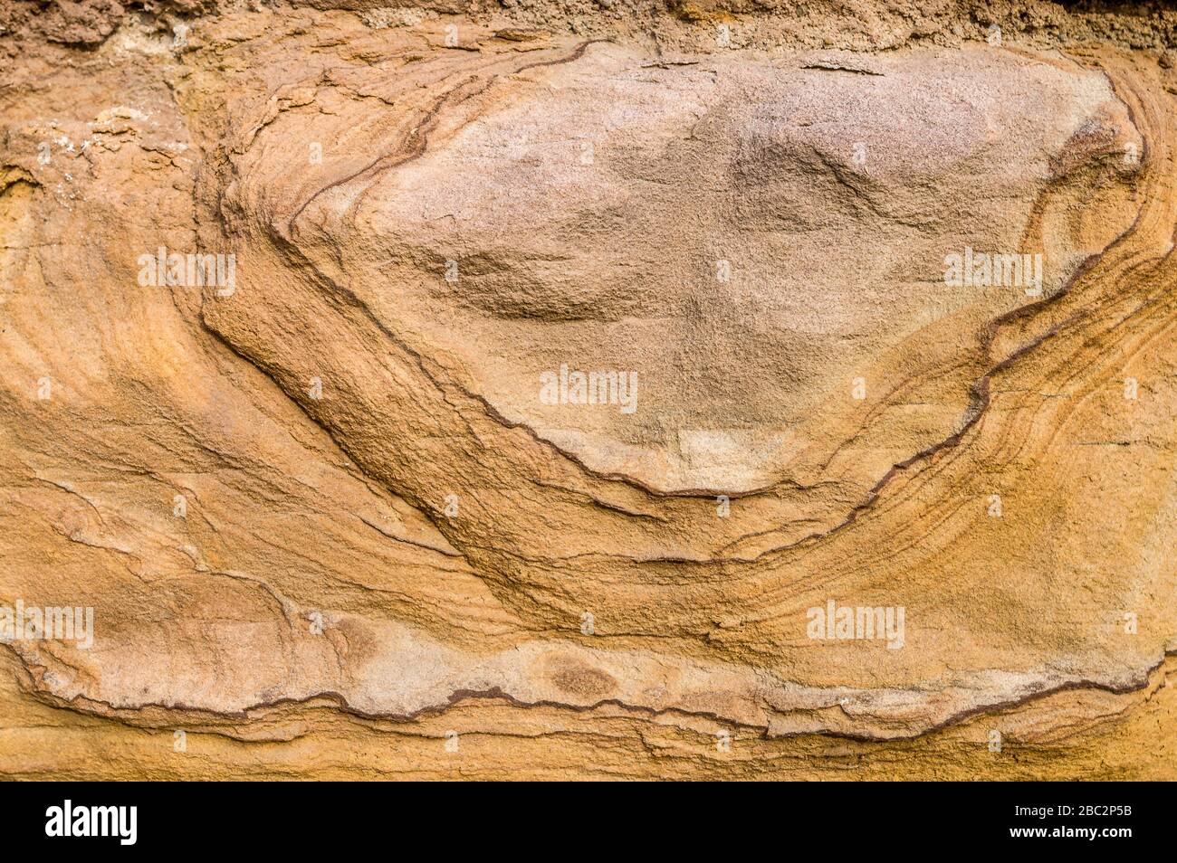 Sandstone wall, sandstone with artistic patterns hatching relief-like ...