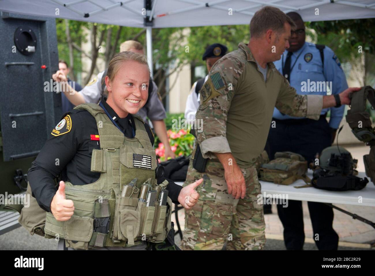 Grinning law enforcement explorer wears a vest Stock Photo - Alamy