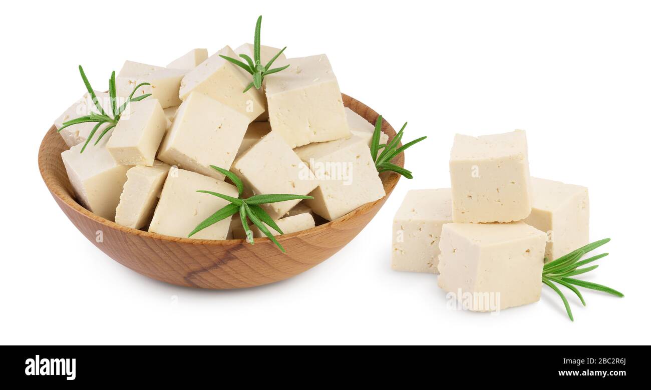 Heap of diced tofu cheese in wooden bowl isolated on white background ...