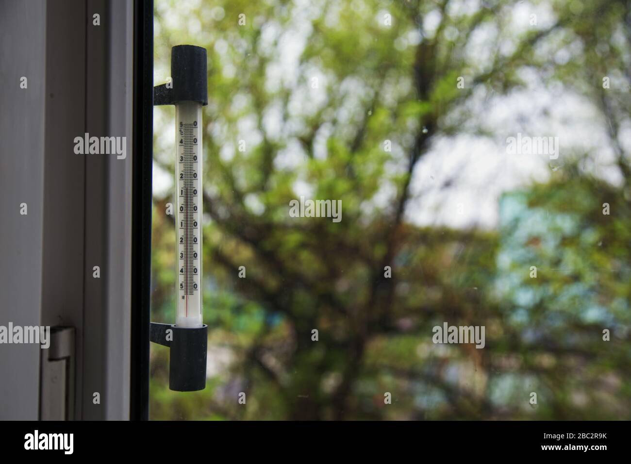 Glass liquid window thermometer showing outdoor temperature. Calibrated ...