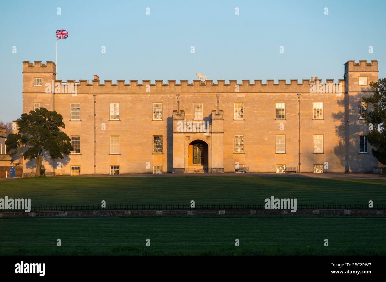 West facade of Syon House during sunny evening with blue sky, and ...