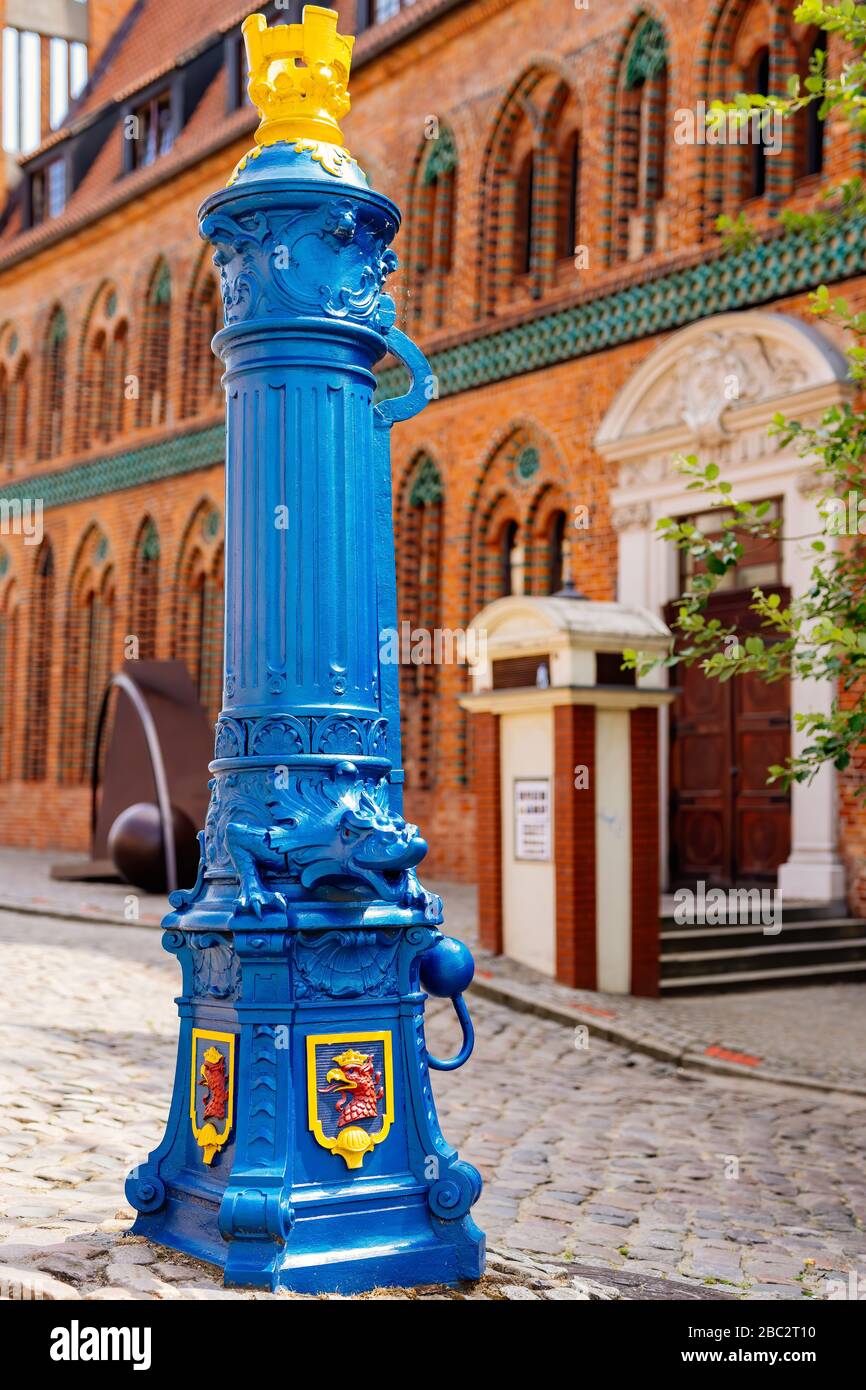 Old traditional blue water pump with gryphon head and crest from ...
