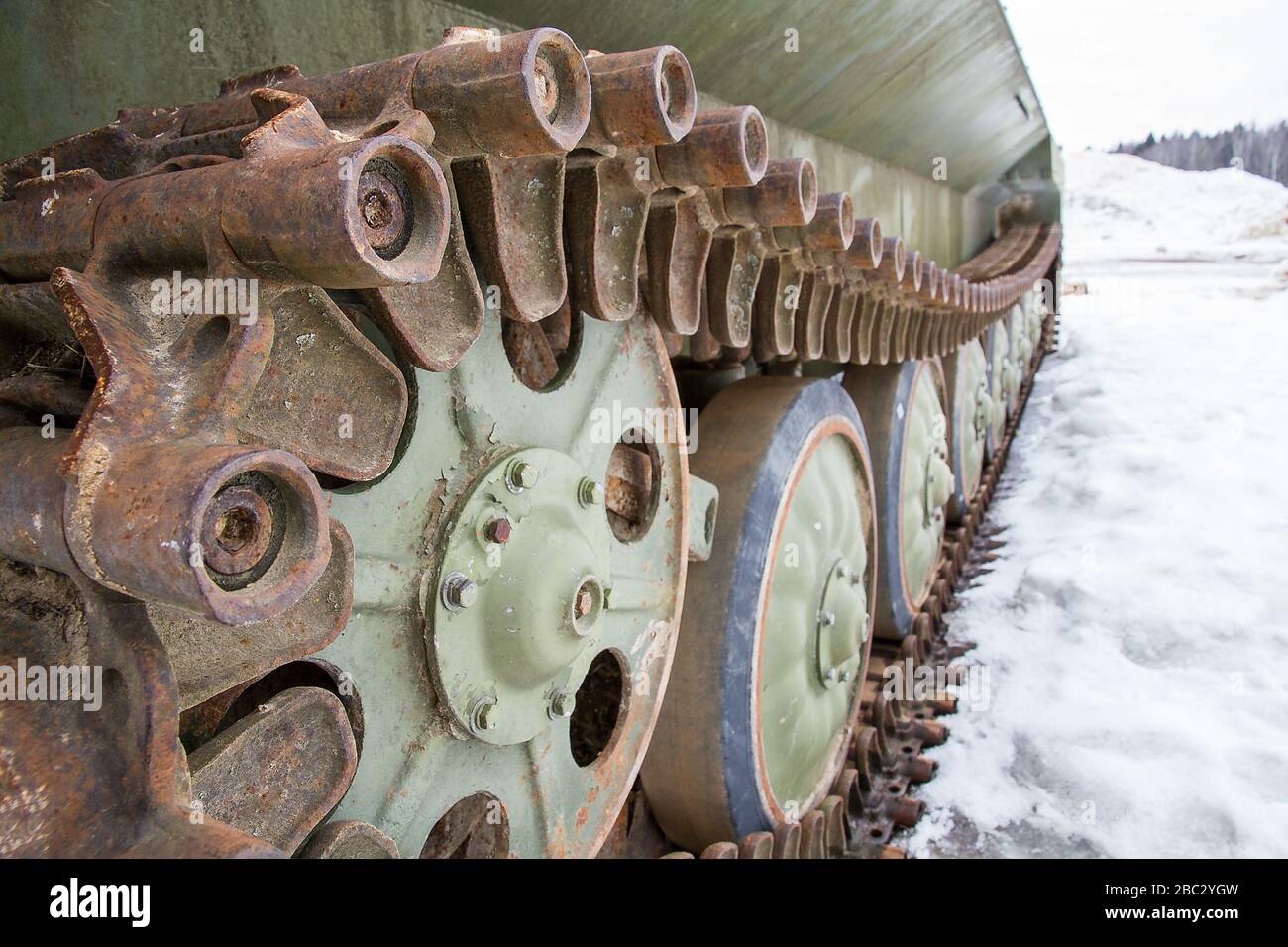 Old armored vehicle crawler suspension close-up Stock Photo - Alamy