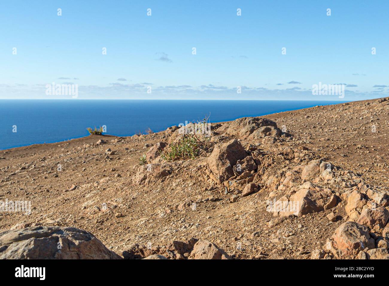 Rocky scorched soil on the western part of Madeira Island in midsummer ...