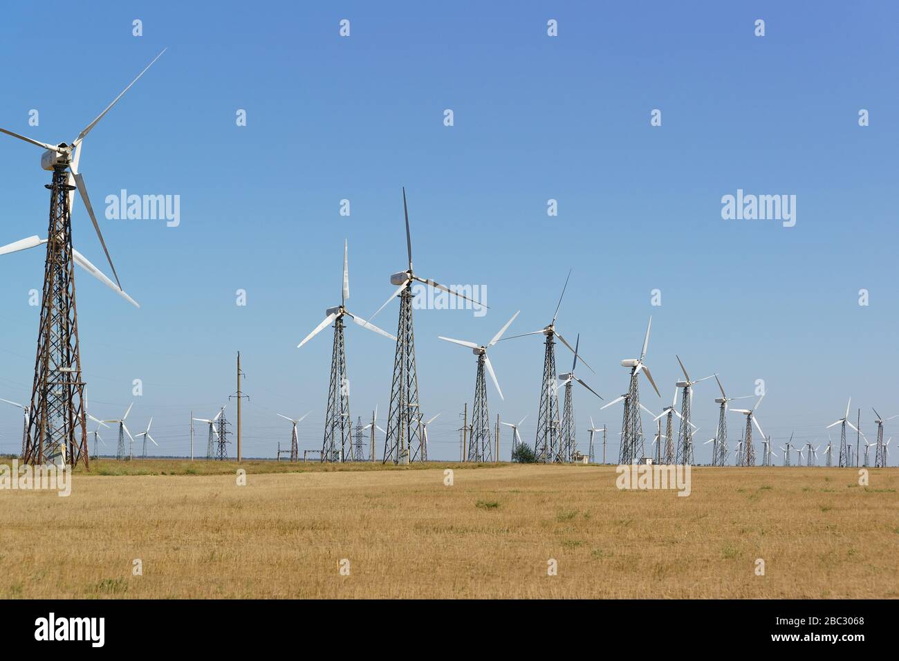 Huge blades of a wind generator on a high mast in the Crimean steppe ...