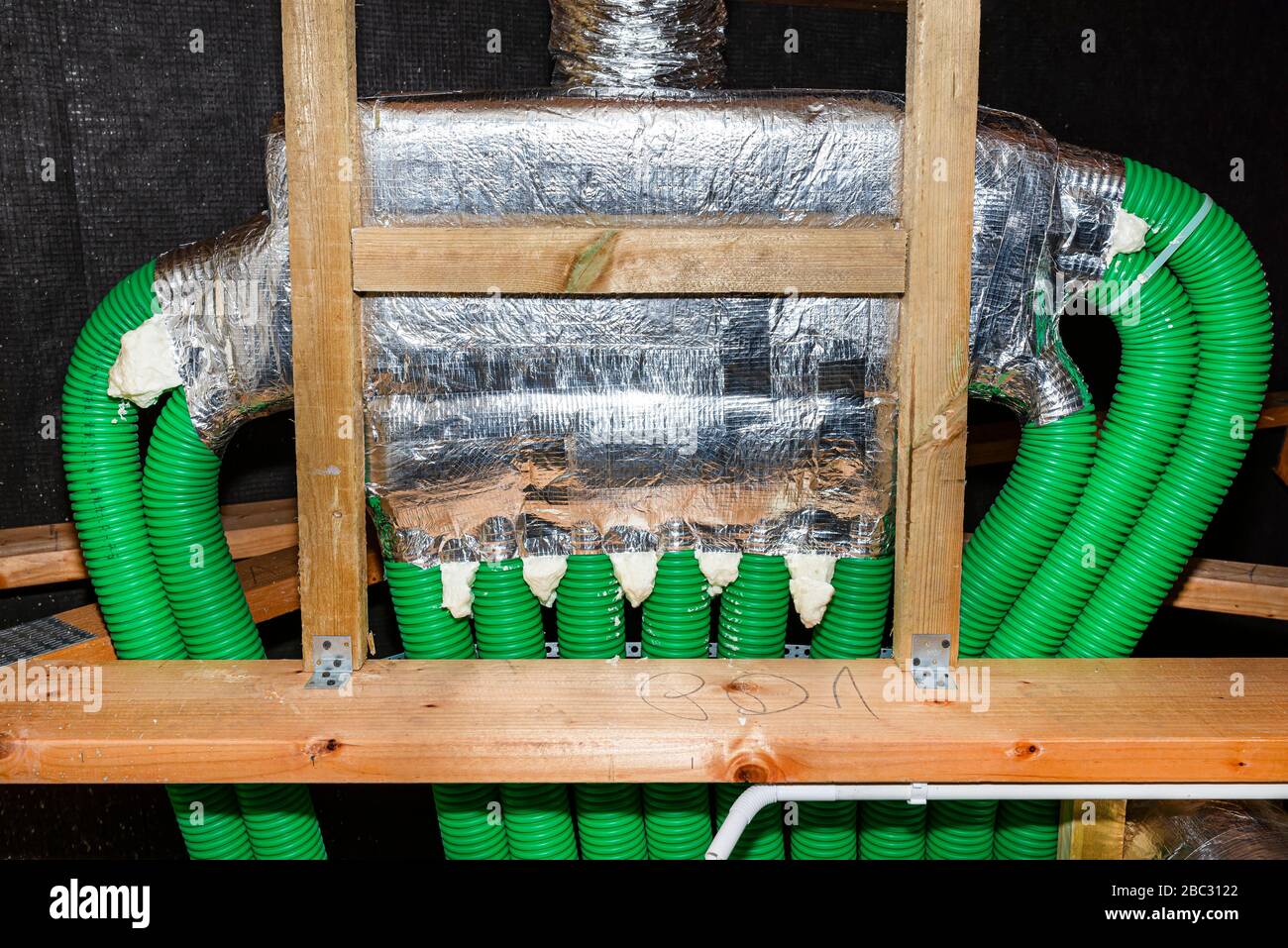 Home energy recovery ventilation, visible manifold and green flexible ...