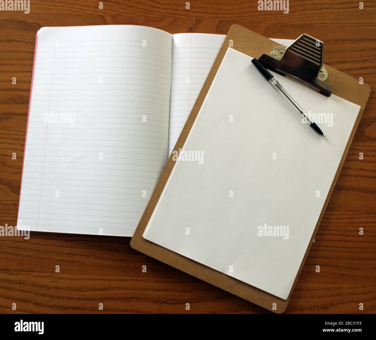 Clipboard on desk in office Stock Photo - Alamy