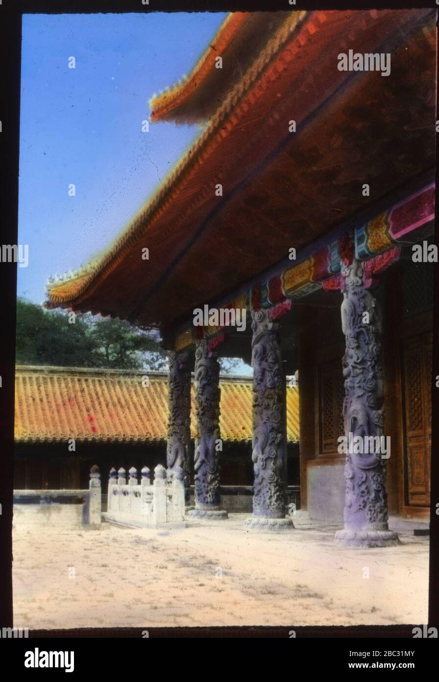 Ground view of a temple with tiled roof and carved pillars, China, ca ...