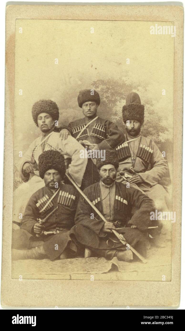Group portrait of five men, seated, facing front Stock Photo - Alamy