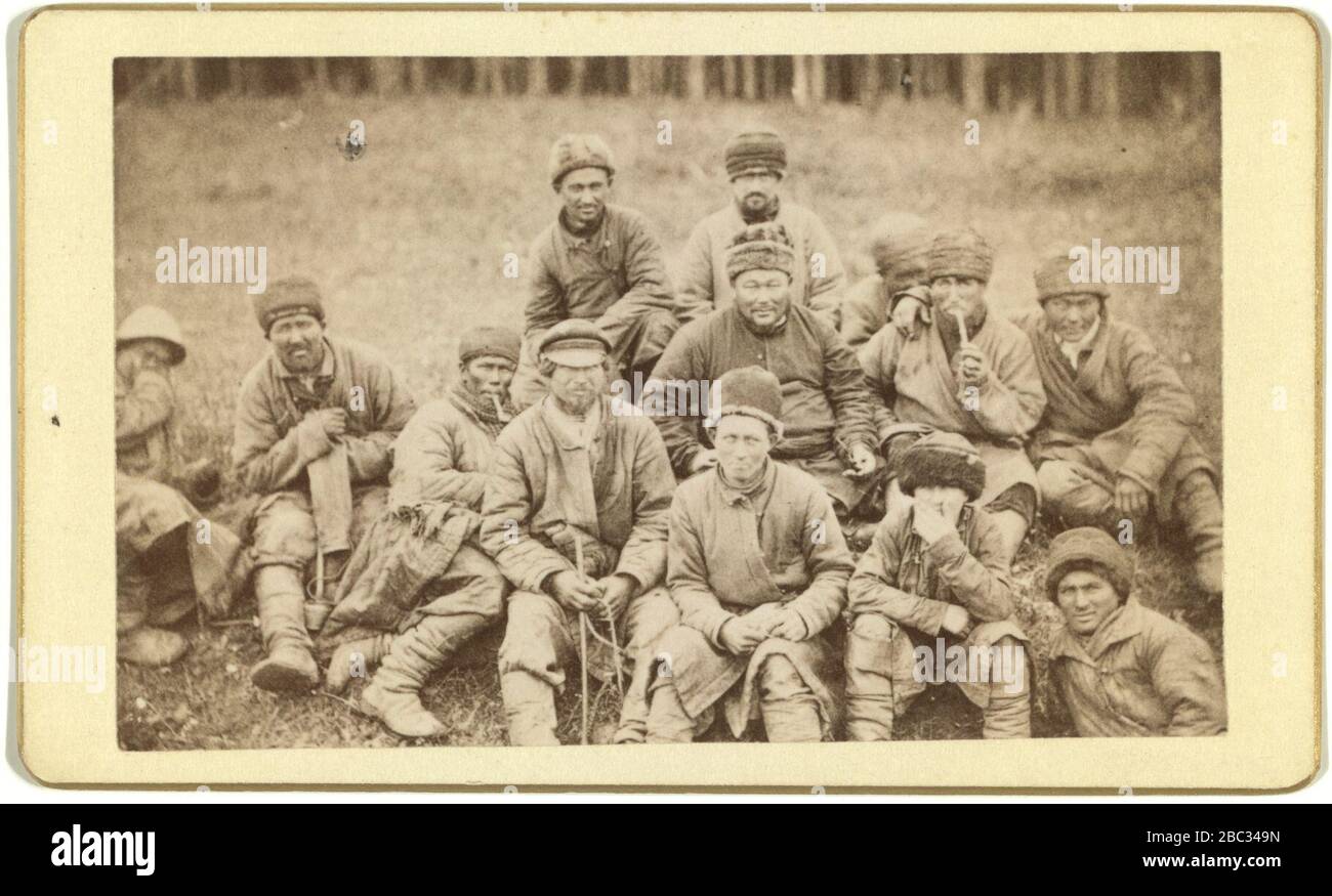 Group portrait of convicts seated in a field Stock Photo - Alamy
