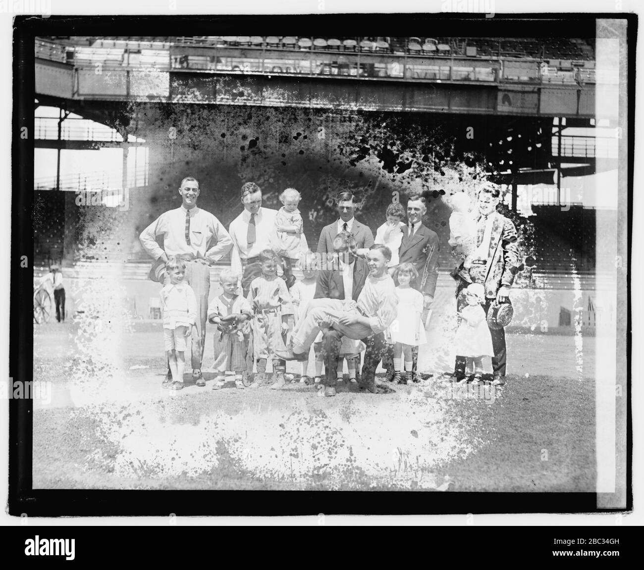 Group portrait of men and children in stadium Stock Photo - Alamy