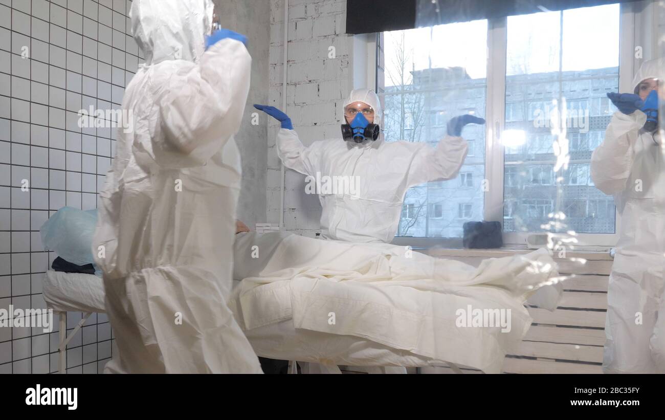 Three doctors dancing in hospital room Stock Photo - Alamy