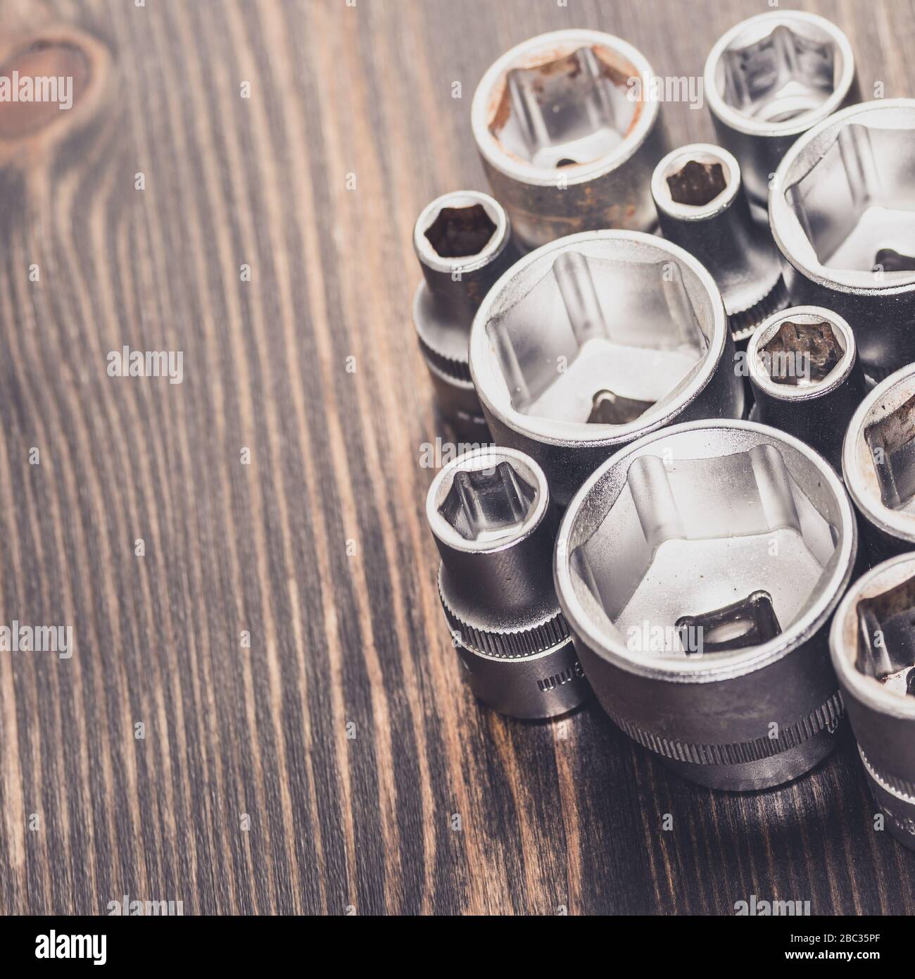 Top view of socket wrenches - old desk background Stock Photo - Alamy