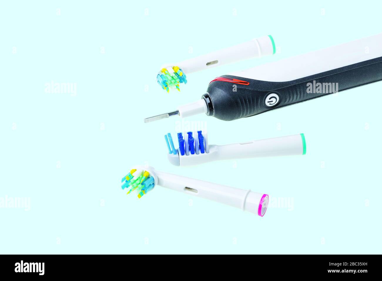 Three kinds of head and toothbrush close up view isolated on blue ...