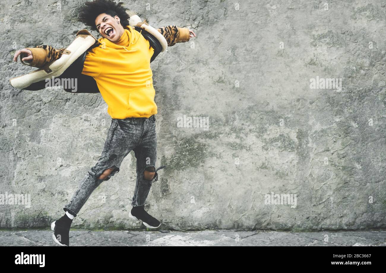 Afro American man having fun dancing in city center - Happy young guy ...