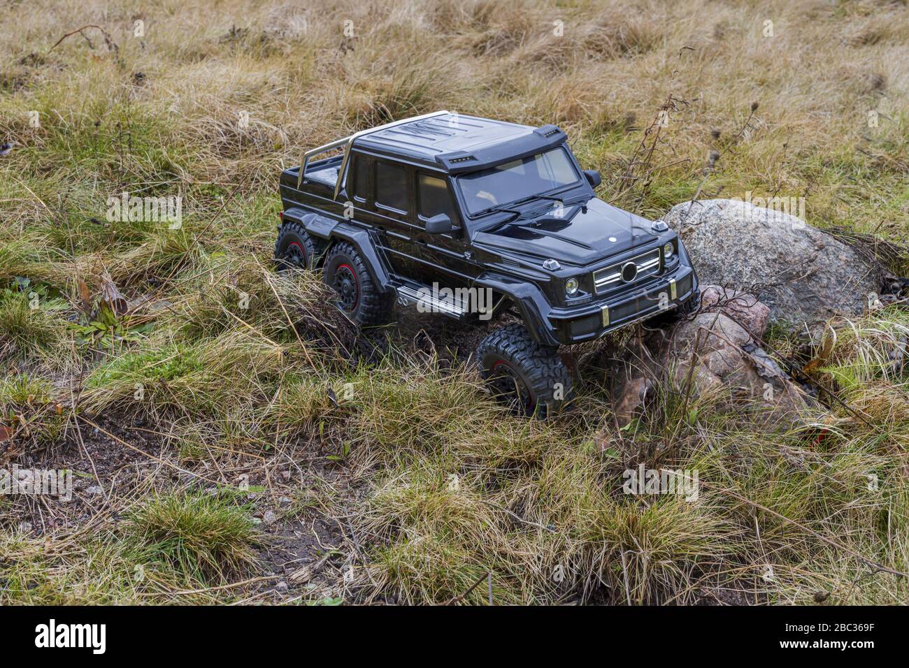 View of radio controlled model racing car on off-road background. Toys ...