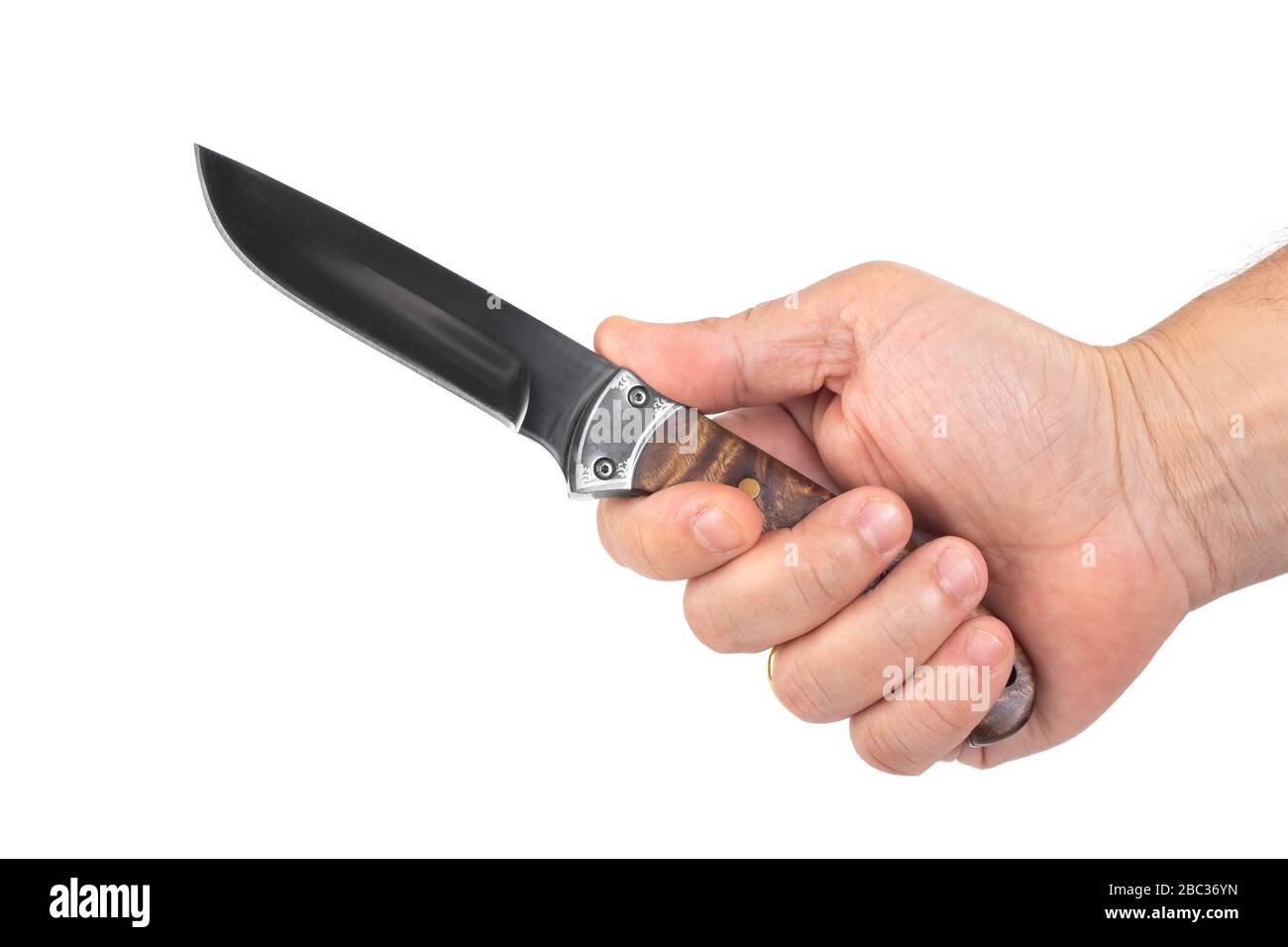 hunting knife in a hand isolated on white background Stock Photo - Alamy
