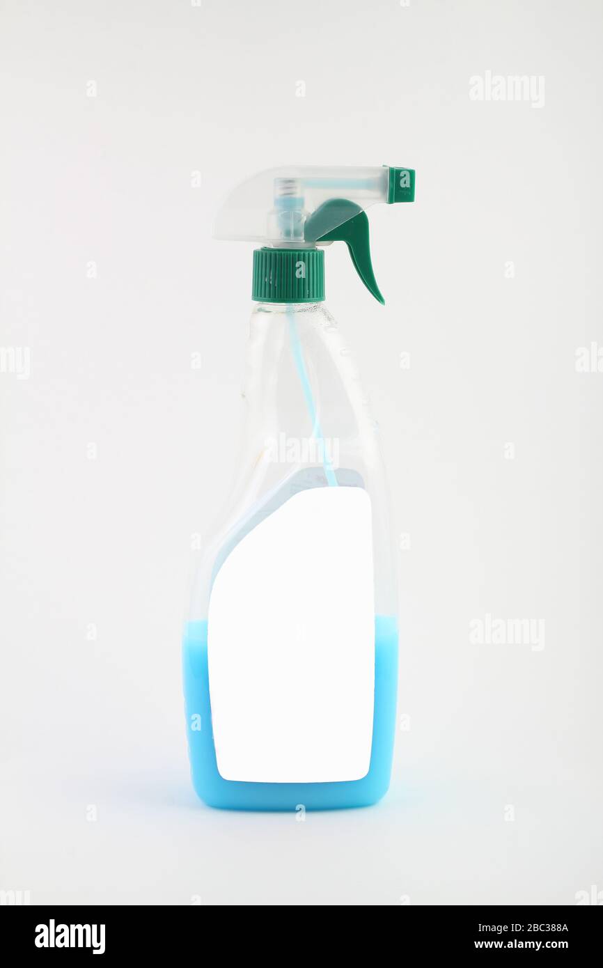 transparent plastic bottle with green spray nozzle, detergent for home ...