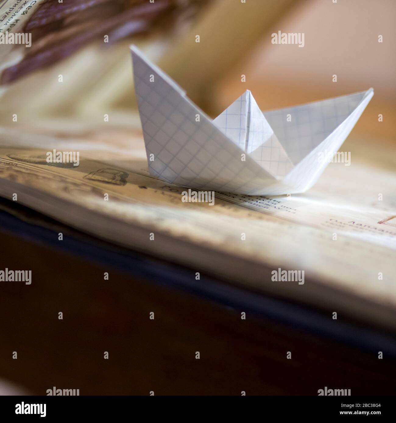 Origami boat, book hi-res stock photography and images - Alamy