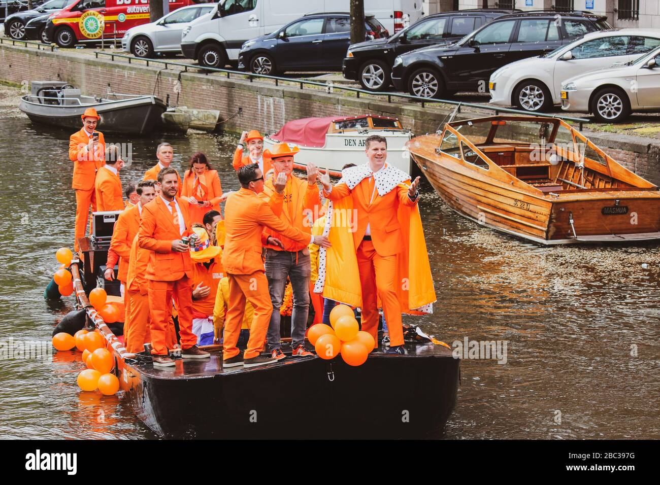 Amsterdam, Netherlands - April 27, 2019: Party boats on canal with ...
