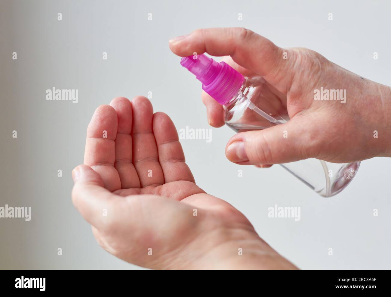 Cleaning hands with an alcohol solution of coronavirus bacteria Stock ...