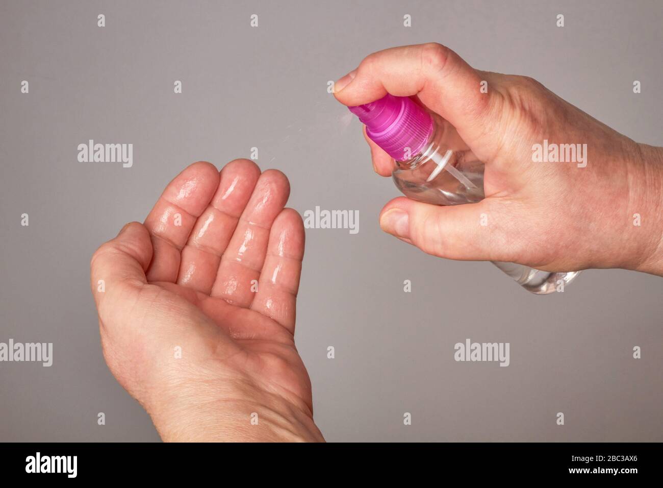 Cleaning hands with an alcohol solution of coronavirus bacteria Stock ...