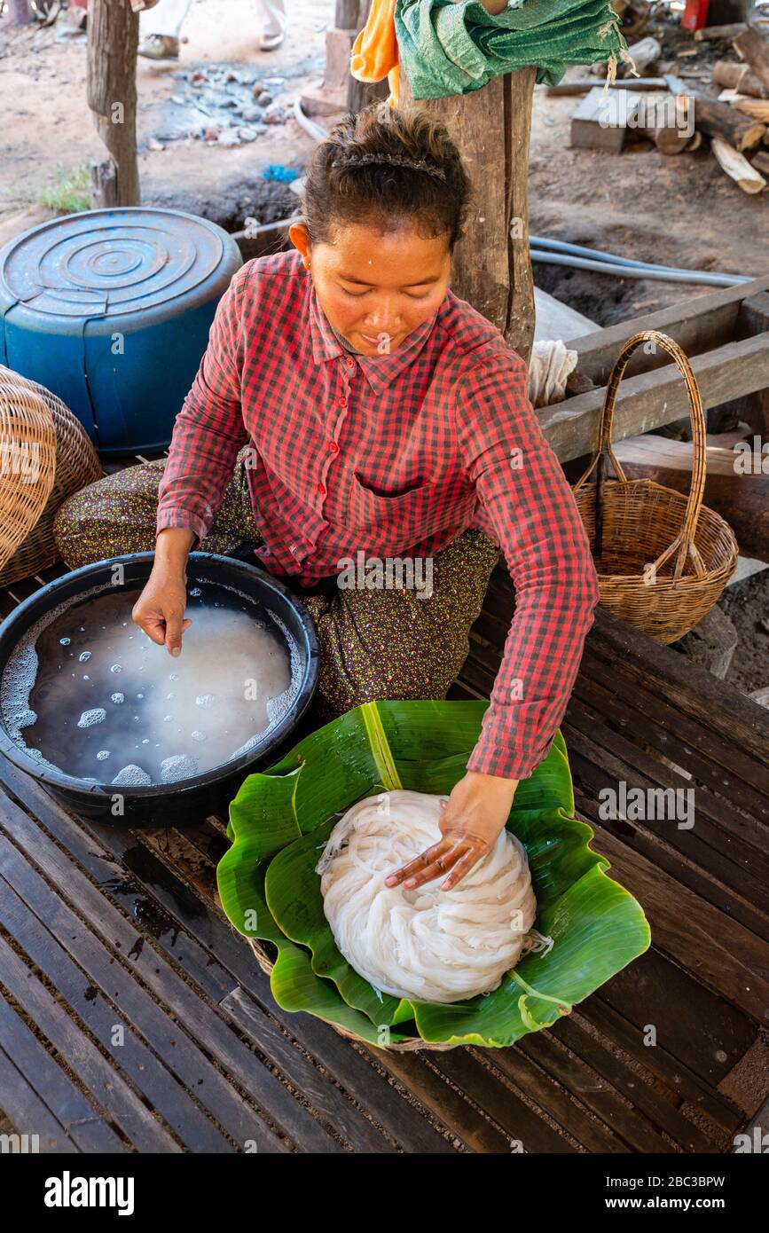 A woman packages rice noodles. Angkor Wat, Siem Reap, Cambodia Stock ...