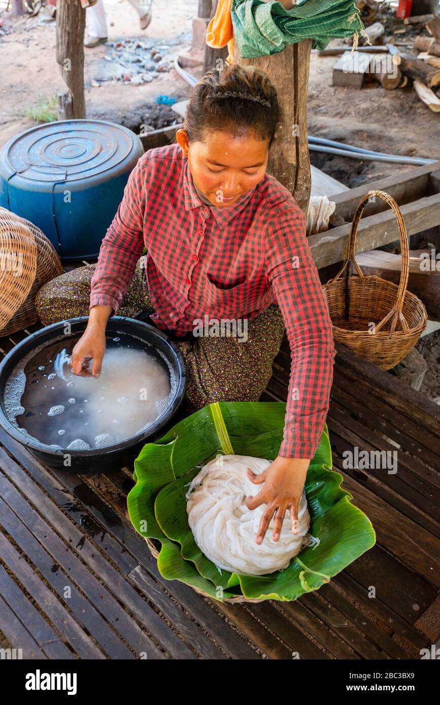 A woman packages rice noodles. Angkor Wat, Siem Reap, Cambodia Stock ...
