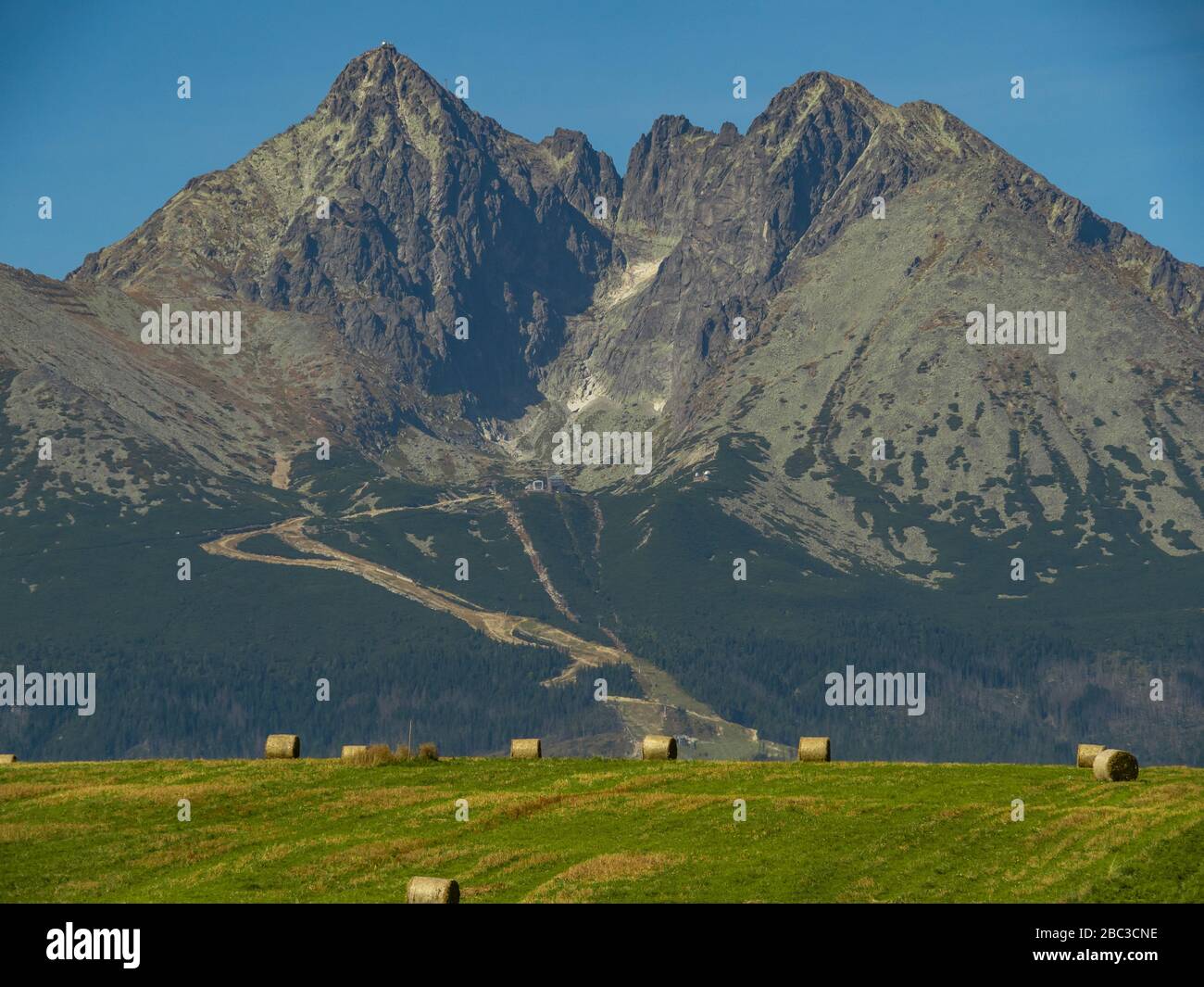 Beautiful summer panorama over Spisz highland with sheaves of hay to ...