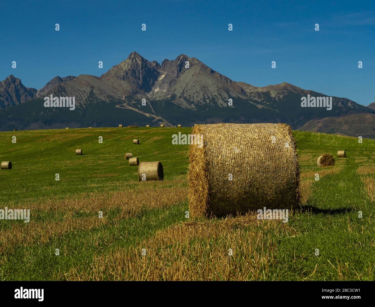 Beautiful summer panorama over Spisz highland with sheaves of hay to ...