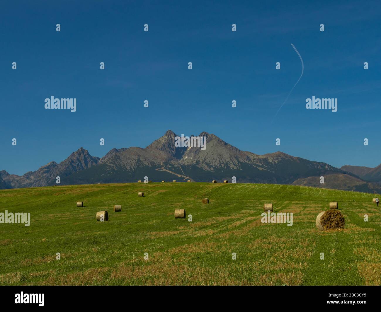 Beautiful summer panorama over Spisz highland with sheaves of hay to ...