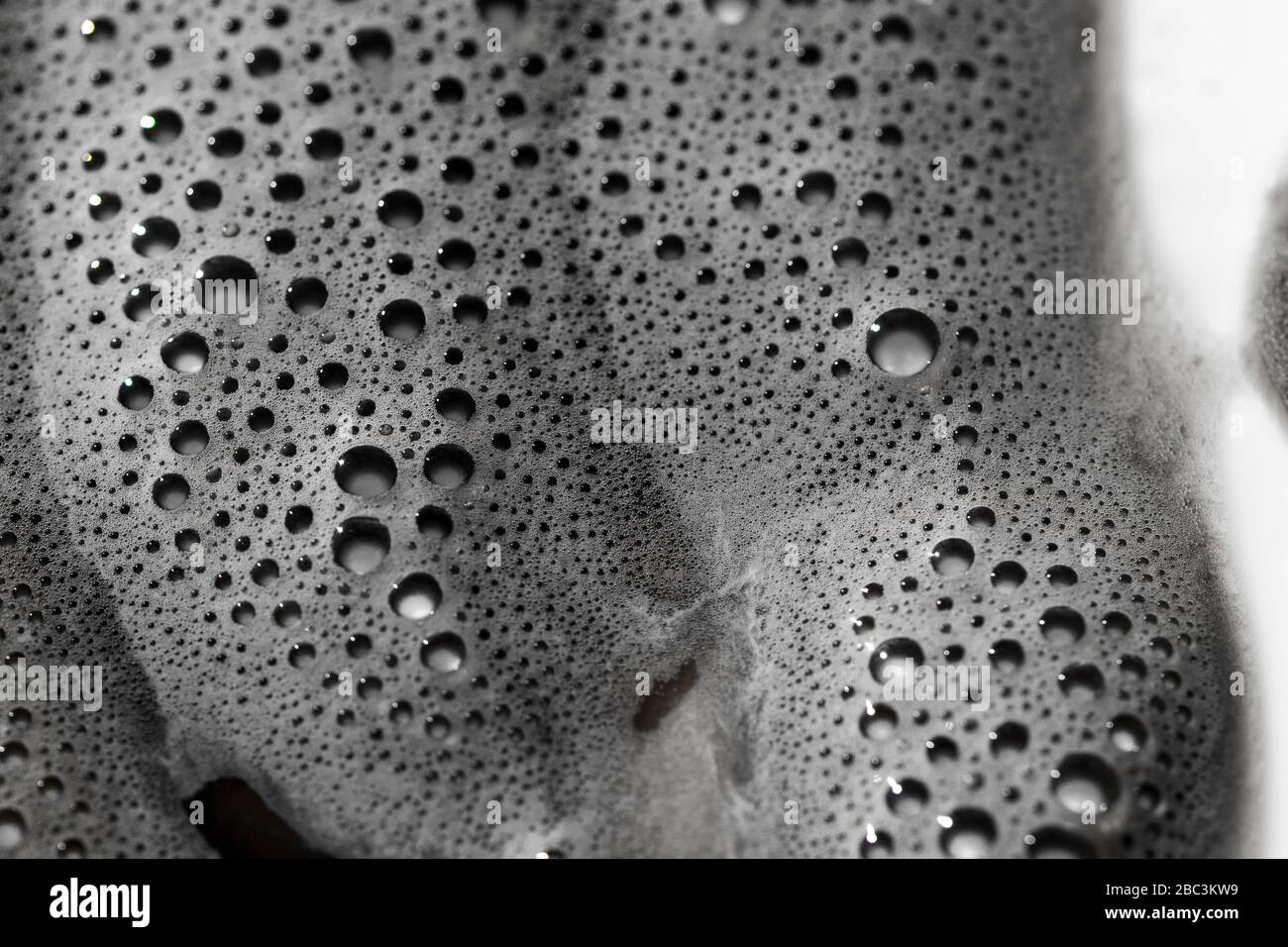 Bubble texture close up frothy foam liquid close up. Fizzy dew small ...