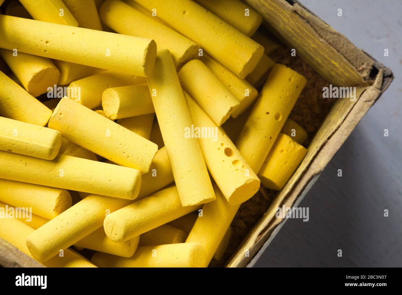 A box of vintage yellow school blackboard chalks Stock Photo - Alamy