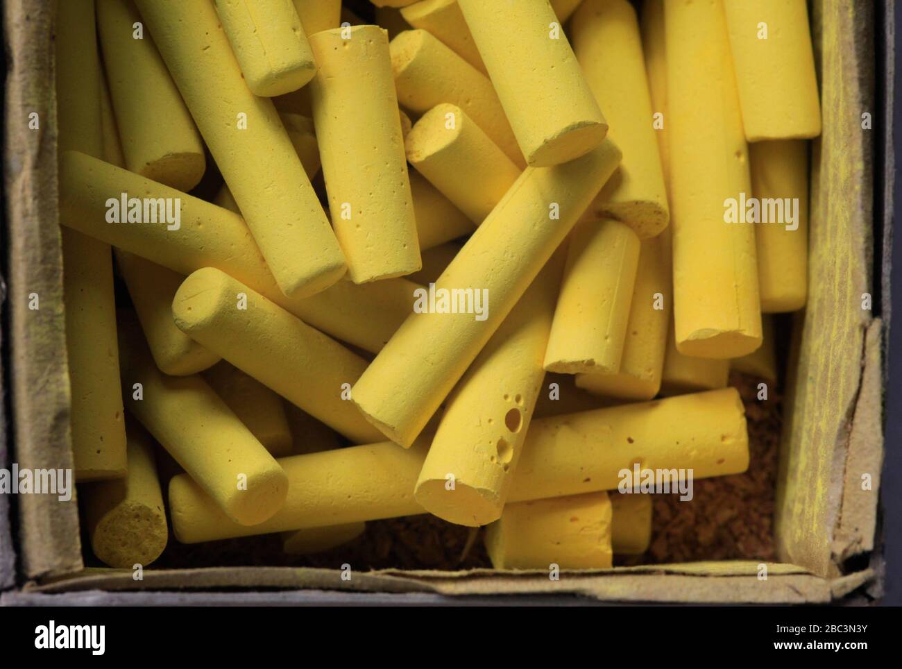 A box of vintage yellow school blackboard chalks Stock Photo - Alamy