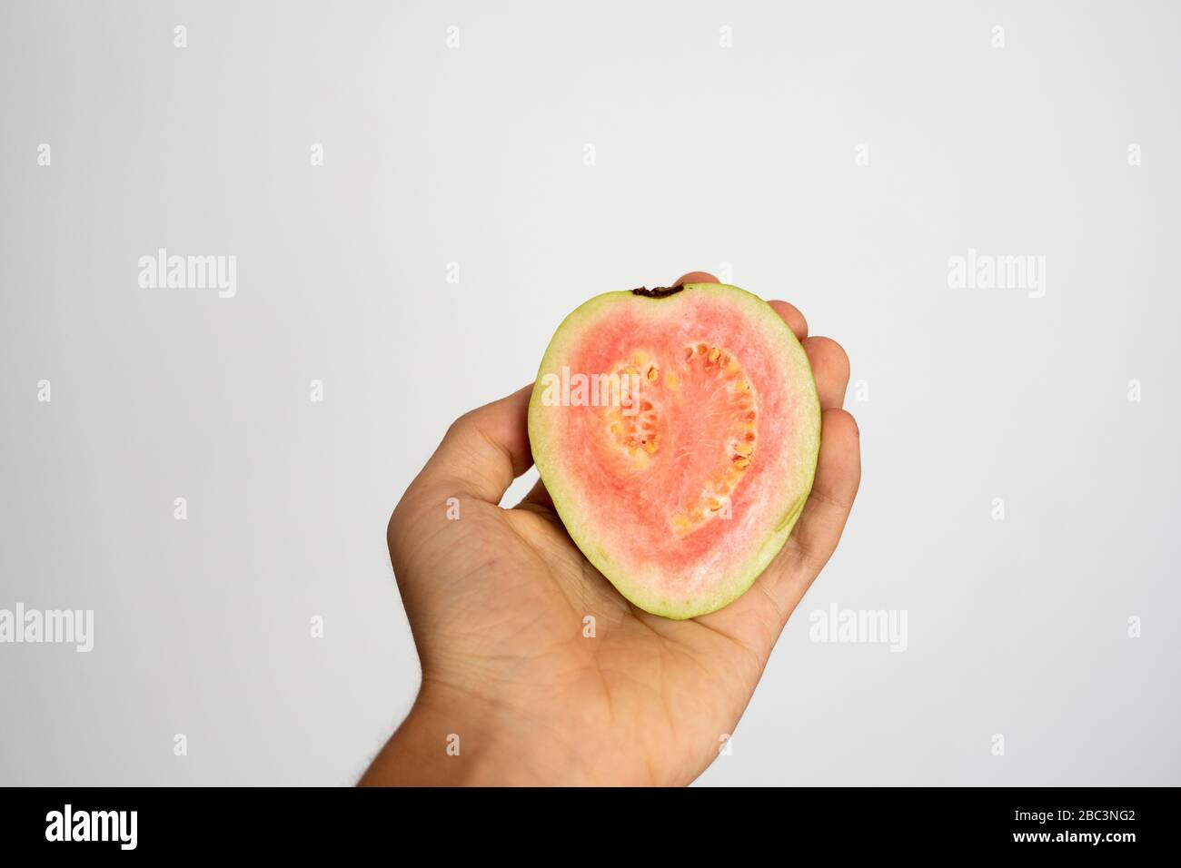 Hand holding guava hi-res stock photography and images - Alamy