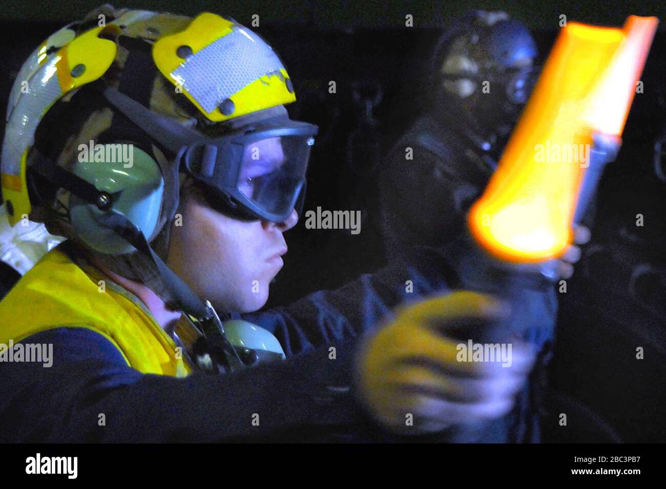 Guiding a landing craft Stock Photo - Alamy
