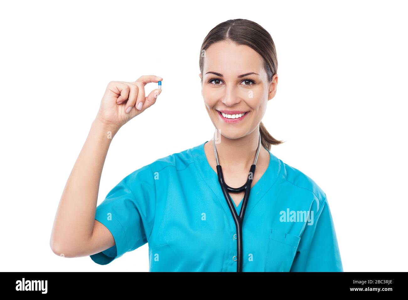 Female doctor holding pill Stock Photo - Alamy
