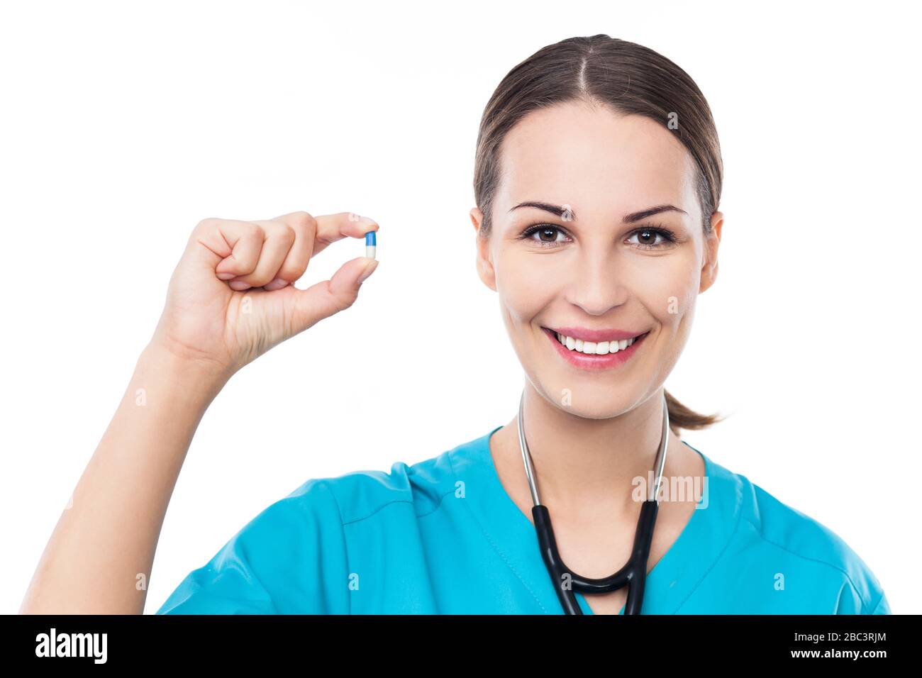 Female doctor holding pill Stock Photo - Alamy