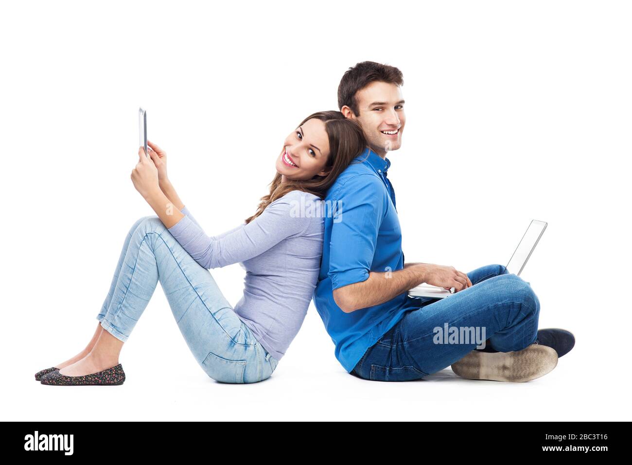 Young couple over white background Stock Photo - Alamy