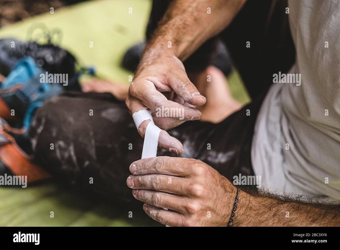 Close up of rock climber hands taping up fingers Stock Photo - Alamy