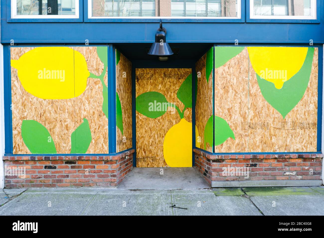 A mural on a boarded up storefront during the coronavirus pandemic ...