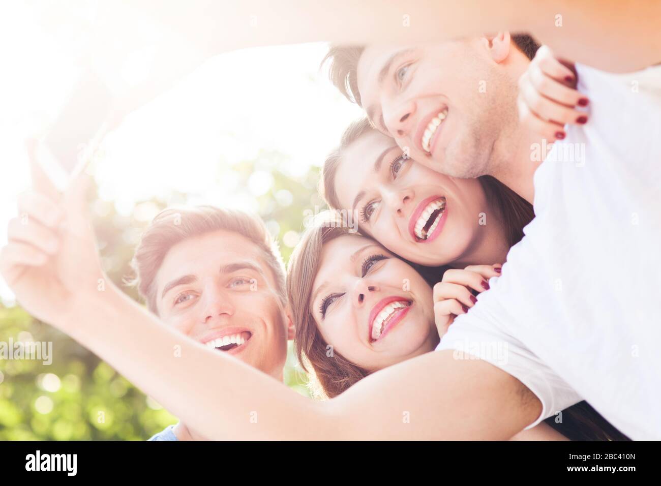 Group of friends having fun outdoors Stock Photo - Alamy