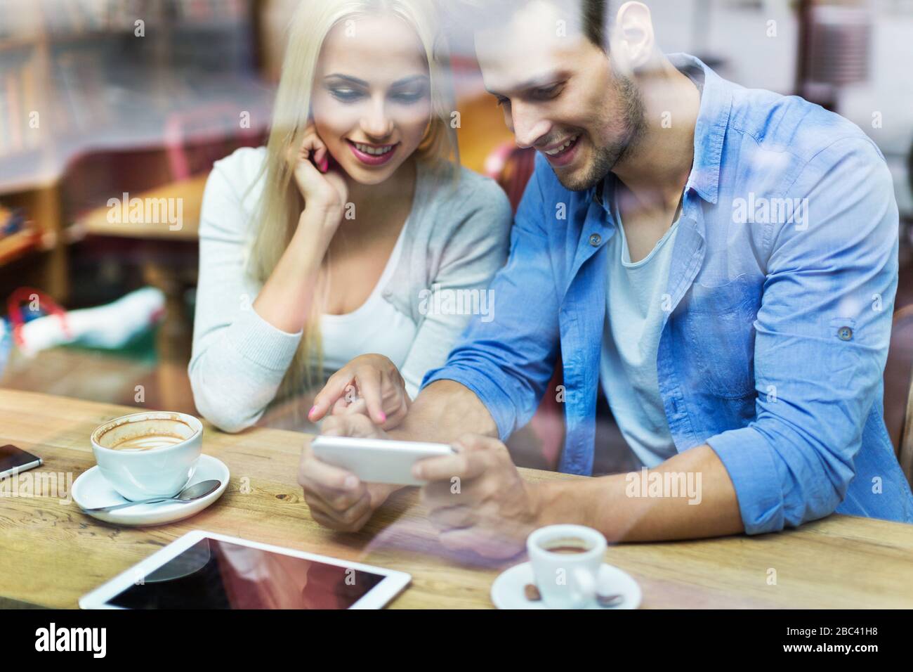 Couple having fun using internet hi-res stock photography and images ...